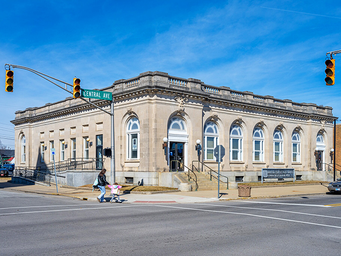 Postal palace perfection! Connersville's stone sentinel stands guard at Central Avenue, where arched windows frame small-town stories better than any Norman Rockwell Saturday Evening Post cover.