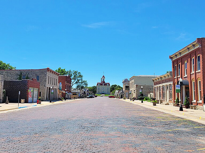 Cottonwood Falls rises from the Flint Hills like a limestone jewel, its historic courthouse crowning a street frozen in prairie time.