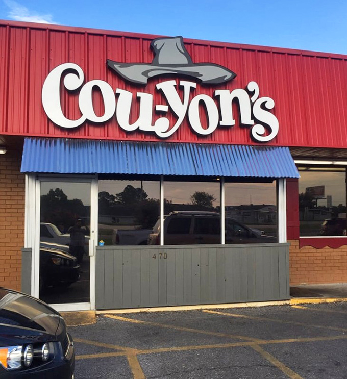 Cou-yon's bright red building with that distinctive cowboy hat logo is like a barbecue lighthouse guiding hungry travelers home.