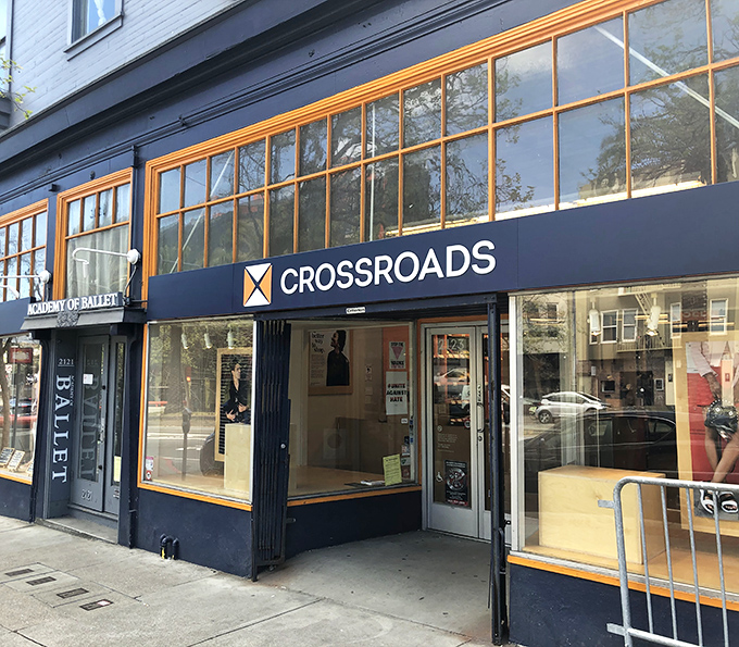 Crossroads Trading's sleek storefront elevates secondhand shopping to boutique status - fashion meets affordability on Market Street.