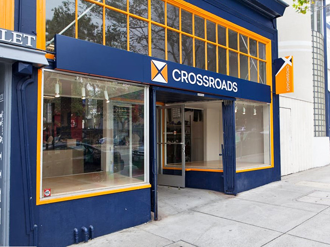 Crossroads Trading's boutique-style windows showcase the elevated thrift experience that makes secondhand shopping feel surprisingly chic.