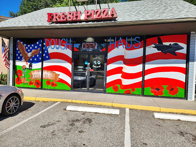 Dough Haus hides behind patriotic flair and a pizza sign. The donut speakeasy of Newport News!