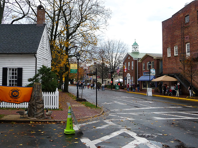 Easton's historic district in autumn, where white picket fences, brick buildings, and fall foliage create postcard-perfect small-town charm.