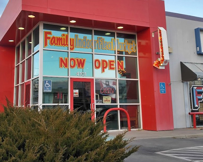 Bright red buildings beacon families toward indoor adventures where weather never ruins the treasure hunt.