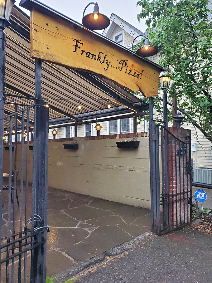 Frankly...Pizza's rustic entrance gate feels like discovering a secret garden where the flowers are made of dough.