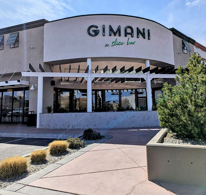 Gimani's sleek curves and contemporary design hint at the artisanal pizza experience waiting inside. Architecture that makes promises the food keeps!
