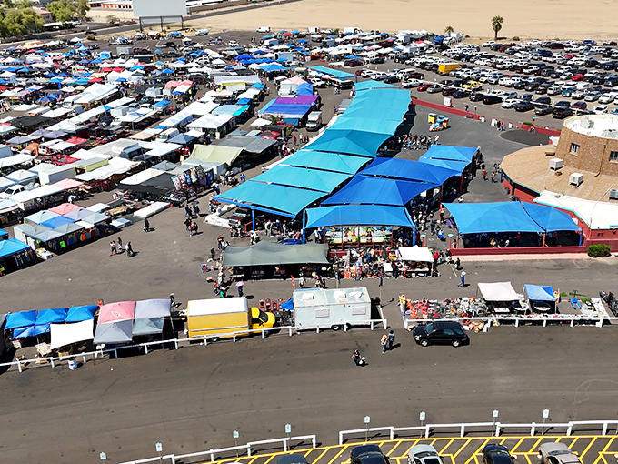Treasure city from above! Glendale's market spreads like a blue-tented metropolis where each canopy shelters potential heirlooms and that lamp your spouse will definitely question.
