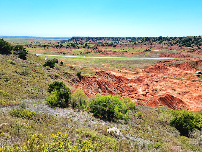 Red earth stretches endlessly like Mars relocated to Oklahoma, spectacular and surprisingly close to home.