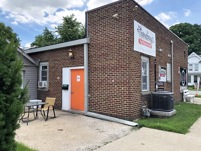 That bright orange door isn't just welcoming&mdash;it's practically begging you to discover Columbus's best-kept crispy secret inside.