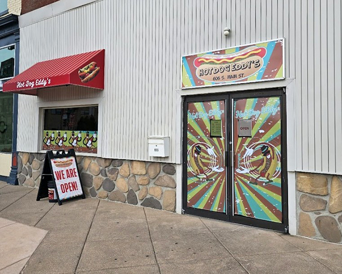 Hot Dog Eddy's psychedelic doors promise a flavor trip that's worth every colorful bite.