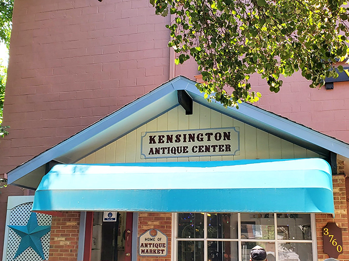 Kensington's turquoise awning pops against pink walls &ndash; a colorful invitation to explore decades of design and nostalgia.