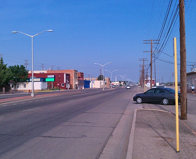 A quiet afternoon in La Junta brings small-town charm to life along its welcoming main street under a clear sky.