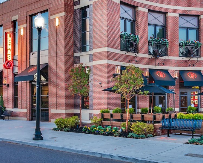 Lena's elegant brick building and lush patio plants create an oasis where pizza dreams come true. Pinch yourself &ndash; it's real!