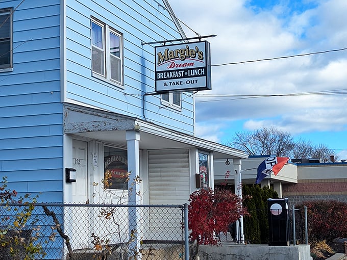 Margie's Dream Diner's blue siding stands out like a delicious mirage on Manchester's Hayward Street, promising breakfast worth dreaming about.