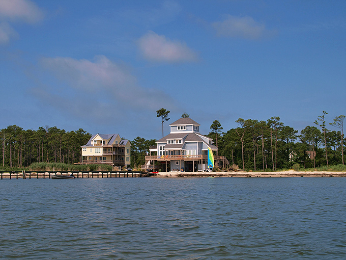 Waterfront homes dot the shoreline where the bay meets the land, each with its own private slice of paradise.