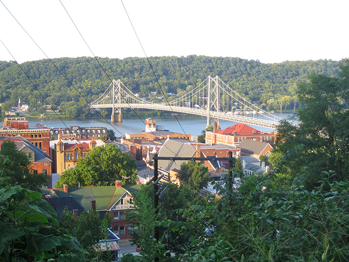 Bridge to somewhere special! Maysville's stunning suspension bridge spans the mighty Ohio, connecting historic brick buildings to tree-covered hills in a scene worthy of a Kentucky tourism commercial.