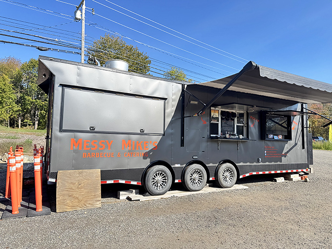 Messy Mike's mobile BBQ setup proves great smoke rings don't require brick and mortar. BBQ innovation on wheels!