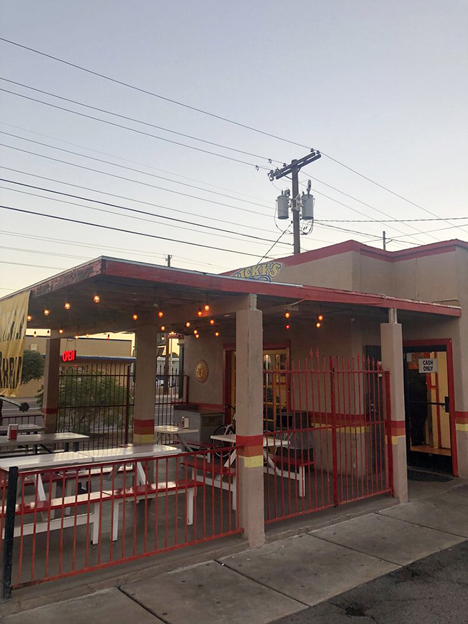 Micky's vibrant red and yellow building stands out like a hot dog oasis. Those colorful walls hint at the flavorful creations inside.