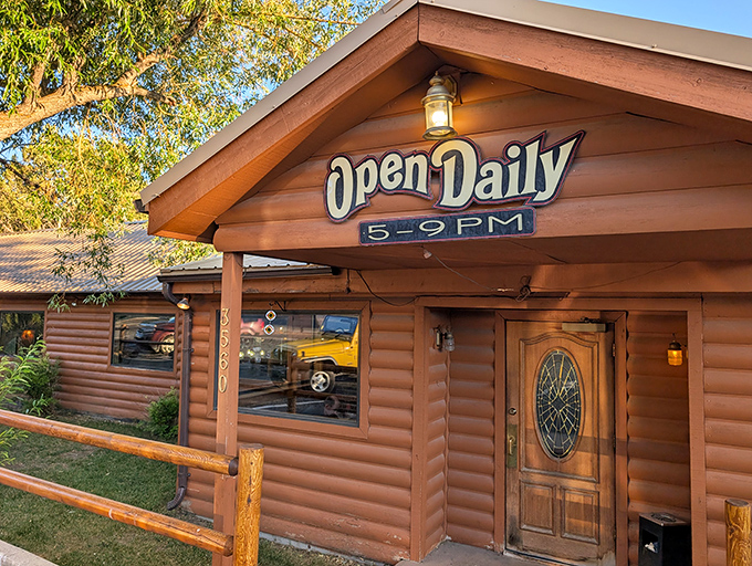 Log cabin exterior promises rustic charm while delivering steaks worthy of any big city.