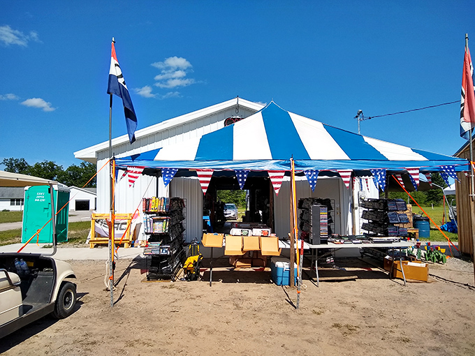 Stars and stripes shopping! This patriotic tent welcomes bargain hunters with American flair and promises of treasures within.