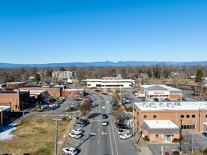 Historic downtown buildings nestle against rolling hills like they've found their perfect spot in the world.