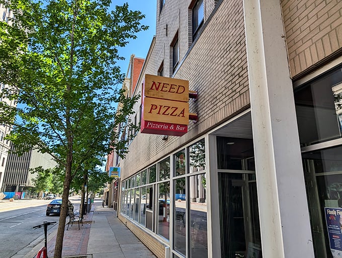 "NEED PIZZA" &ndash; now that's truth in advertising! This downtown spot understands our most basic cravings.