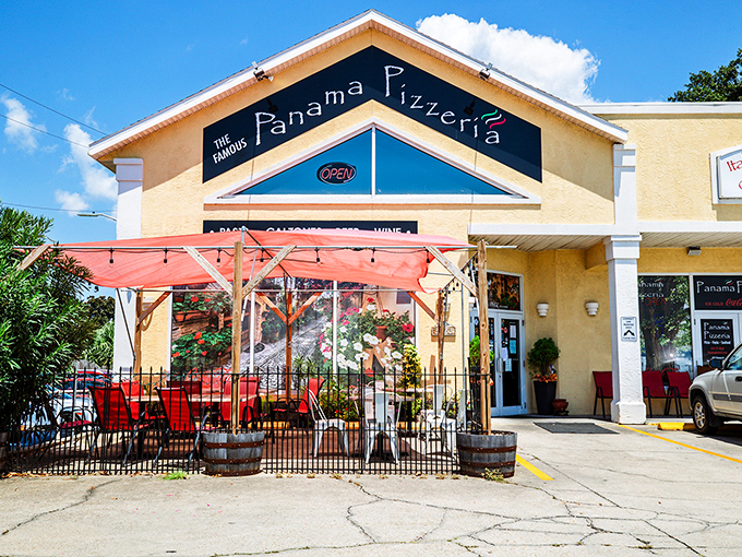 That sunny yellow building with the festive red patio is like Florida sunshine in architectural form. Panama Pizzeria's cheerful exterior matches the mood you'll be in after tasting their pies.