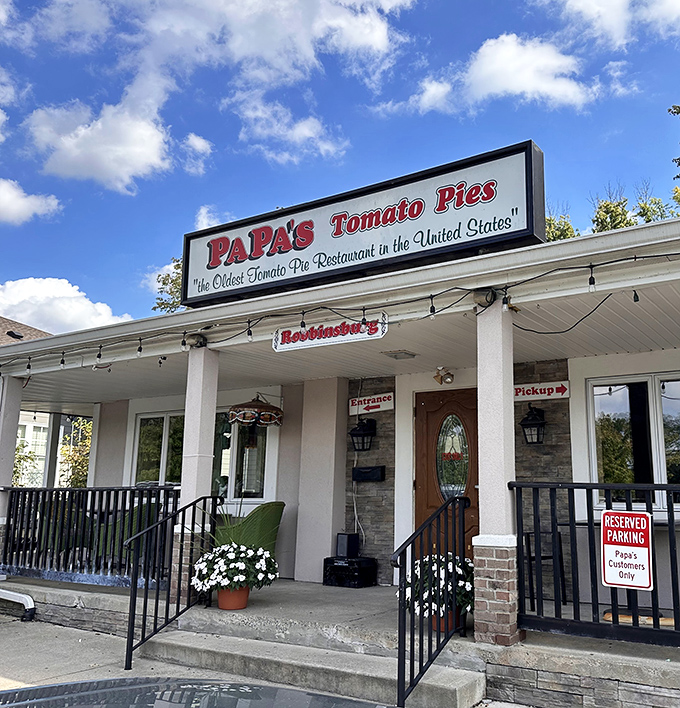 Papa's Tomato Pies welcomes visitors with flowers and a promise of history. America's oldest tomato pie restaurant still draws crowds for good reason.