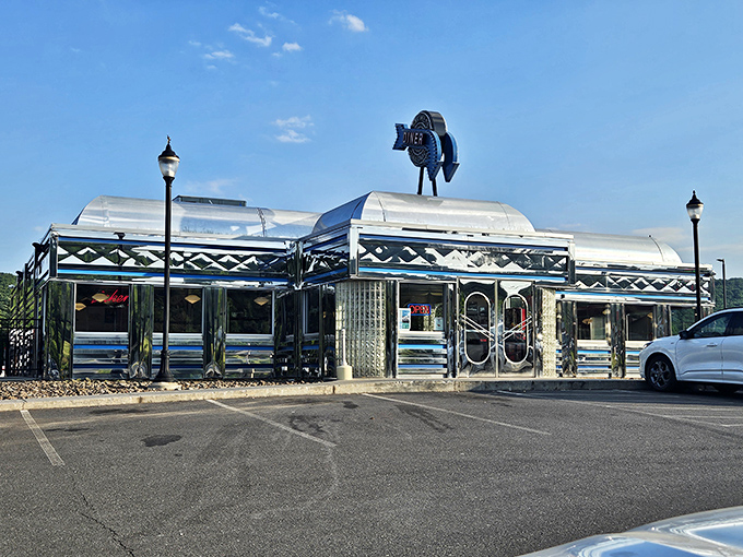 The Pine Grove Diner shines like a chrome dream, with that whimsical fish sign suggesting there's plenty of personality on the menu.