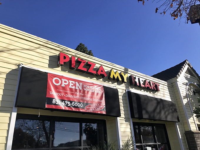 Pizza My Heart wears its beach town roots proudly. That sunny yellow building houses surfer-approved slices.