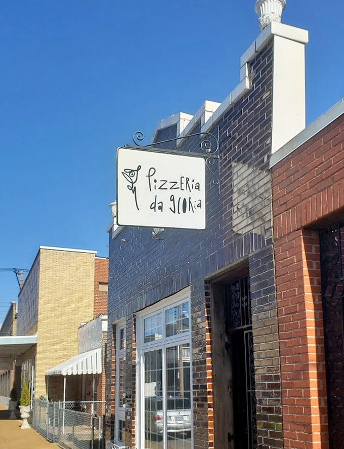 That hand-painted sign promises authenticity, and Pizzeria da Gloria absolutely delivers on it.