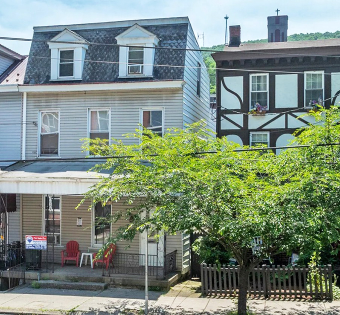 Charming old homes line a quiet Pottsville street, where character, color, and neighborly warmth create a welcoming small-town feel.