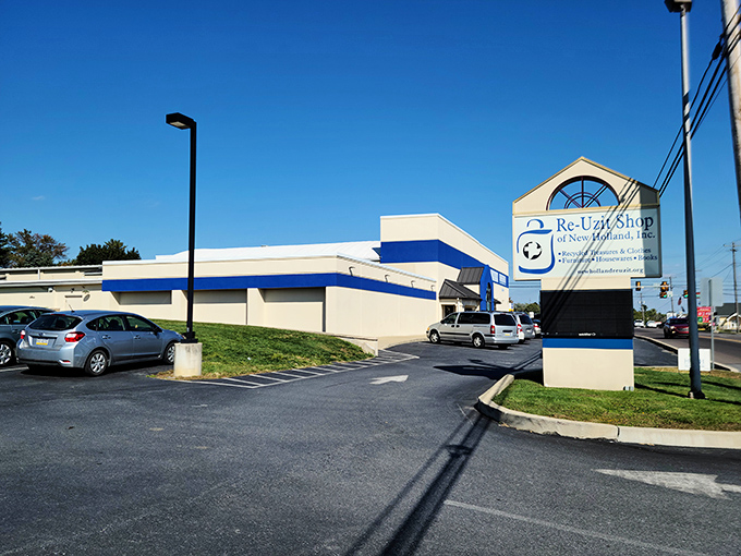 That cheerful blue and white sign promises recycled treasures and sustainable shopping satisfaction.