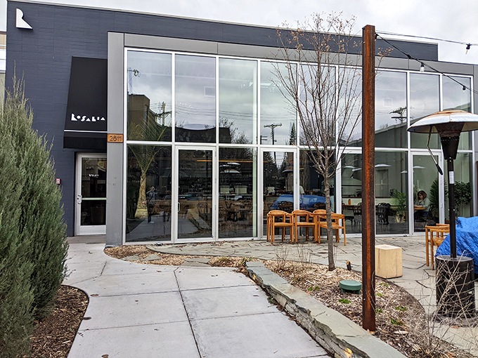 This sleek, modern fa&ccedil;ade houses ancient pizza wisdom &ndash; where fire, dough, and time create magic that no microwave could ever replicate.