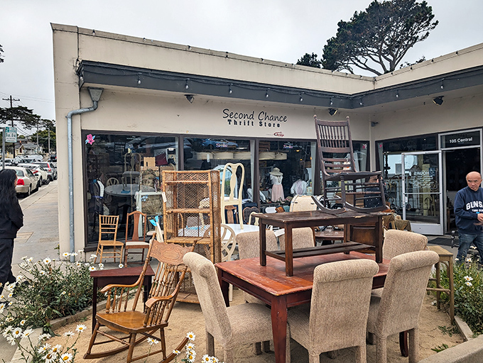 Second Chance's outdoor furniture display shows how coastal living meets thrift store treasure hunting perfectly.