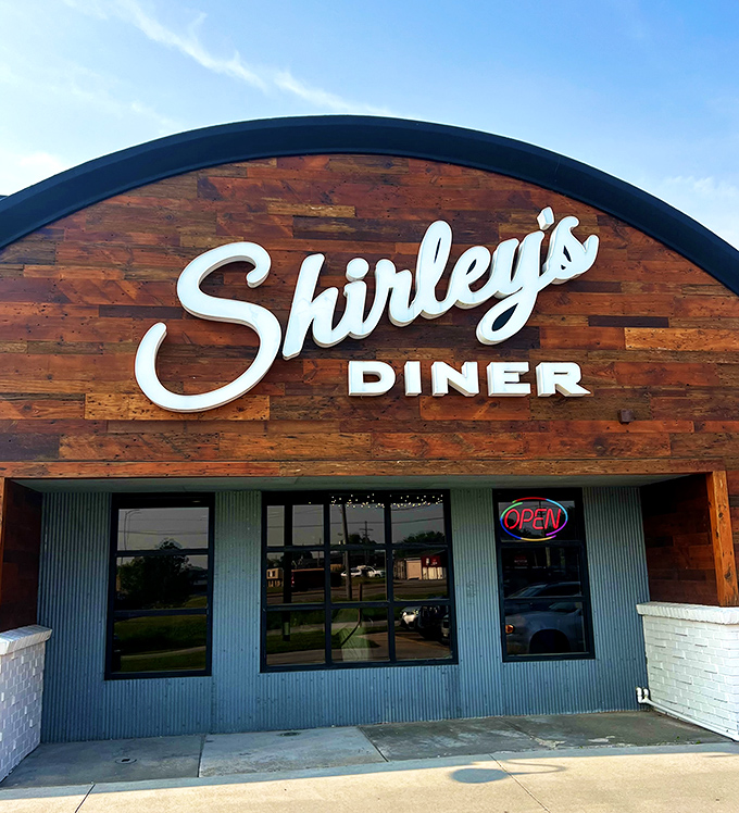 Modern curves meet classic comfort - where contemporary design embraces timeless breakfast tradition beautifully.