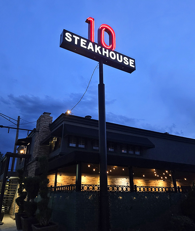 Steakhouse 10's sign glows like a beacon in the night. Simple name, extraordinary flavors waiting just beyond those doors.