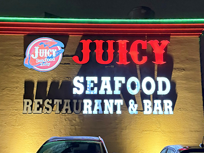 When the sun goes down, Juicy Seafood's neon sign lights up like a beacon for those craving Louisiana-style seafood boils.