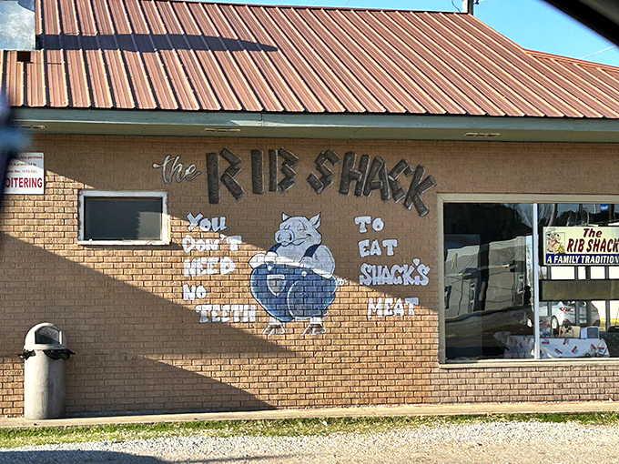 The Rib Shack's painted mascot practically winks at you, promising finger-licking good times ahead.