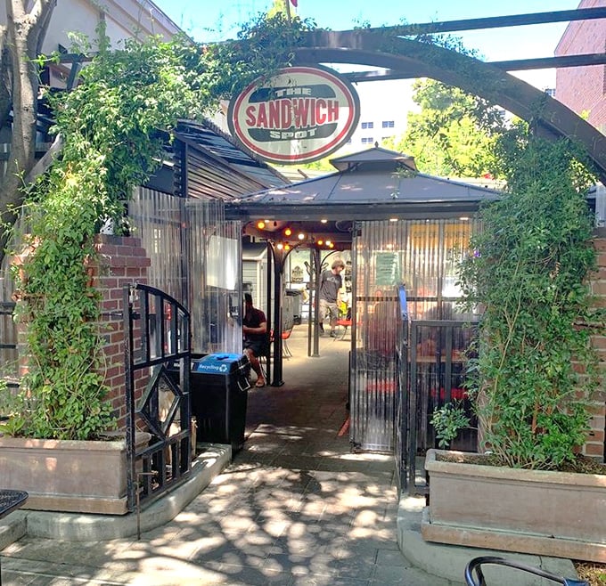 The Sandwich Spot's ivy-covered entrance feels like discovering a secret garden of gourmet delights.