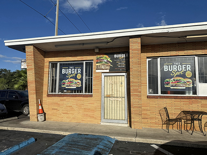 Thee Burger Spot's brick facade gives no hint of the flavor explosion waiting inside. Sometimes greatness hides behind humble doors.