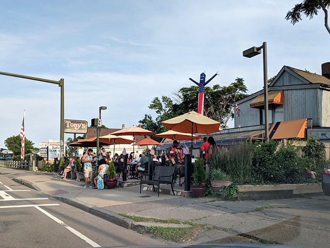 You can enjoy a relaxing afternoon at Tony's Clam Shop while dining under bright umbrellas and soaking up the sunshine.