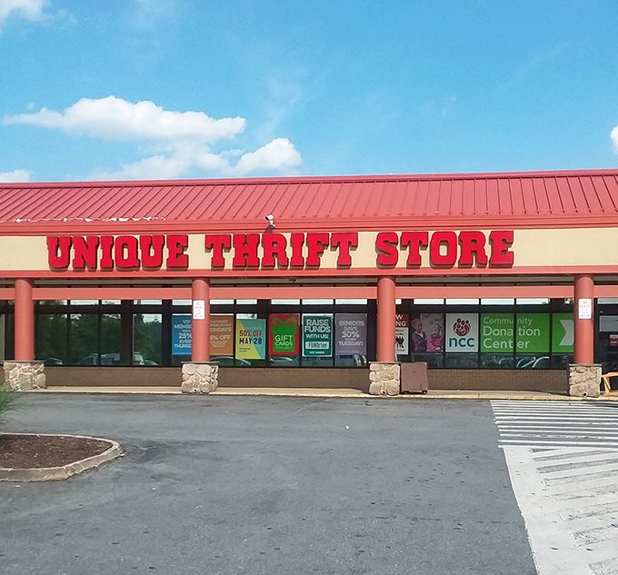 Unique's bold red lettering stands out like a friendly neighborhood beacon, calling bargain hunters to explore its community treasures.