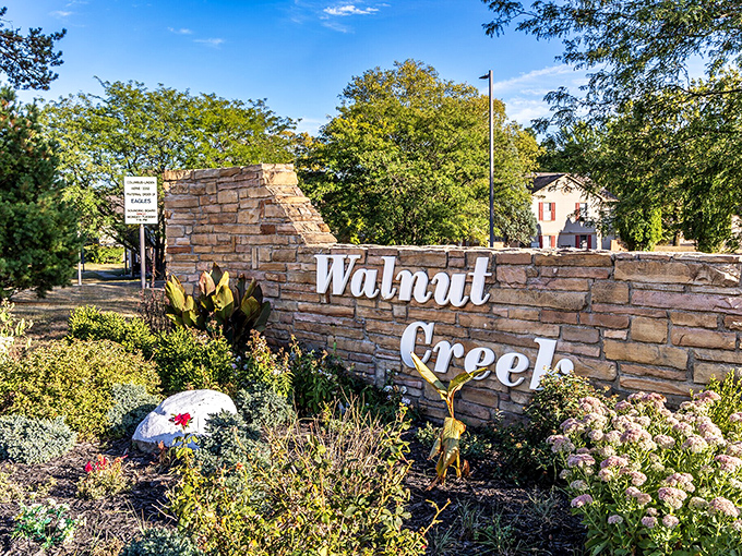The stone welcome sign promises adventures in a place where time moves like honey.