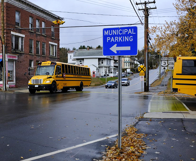 School's out, rain's in! Whitefield's municipal parking sign points the way like a soggy yellow brick road to small-town adventures.