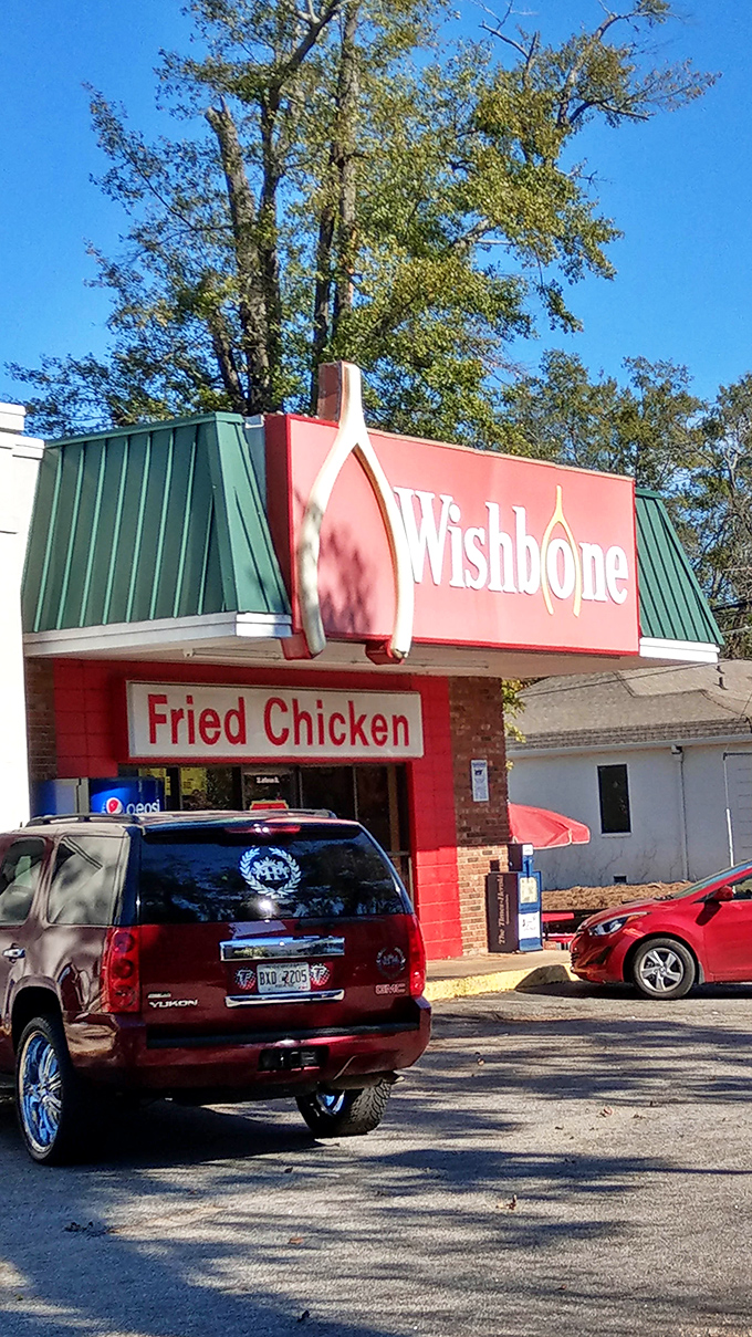 Wishbone's distinctive red building stands out like a beacon for chicken lovers. That architectural wishbone isn't just cute – it's foreshadowing the wish you'll make for seconds.