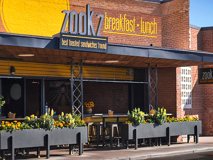 That bright yellow sign catches your eye like a lighthouse, guiding breakfast and lunch seekers to toasted perfection.