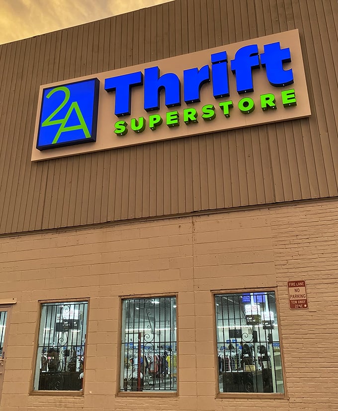 As the sun sets, 2nd Ave's illuminated sign glows like a lighthouse guiding bargain hunters safely to shore.