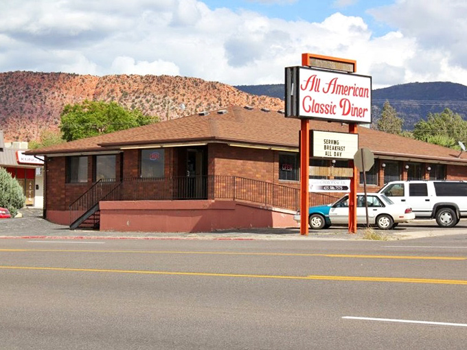 Mountains frame the All American Diner like a postcard from simpler times, when breakfast was served all day and nobody counted calories.
