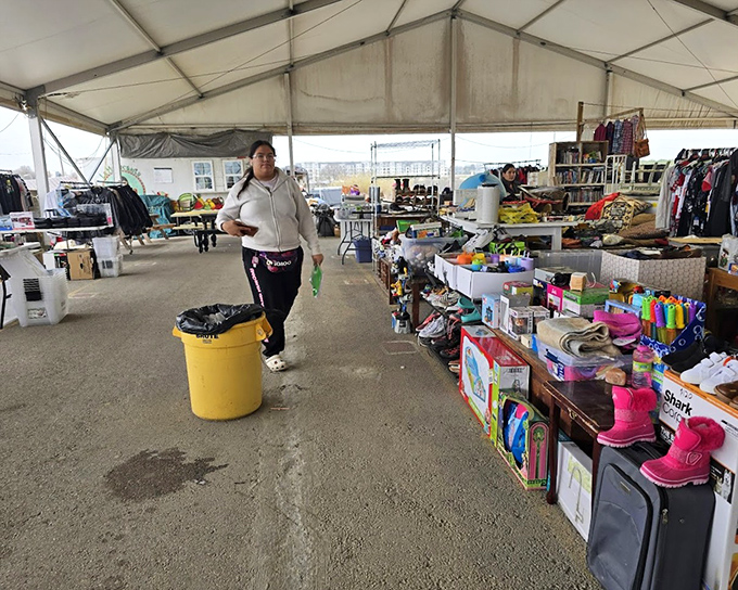 Bright blue barrels and cheerful signs guide shoppers through this uniquely Austin flea market.